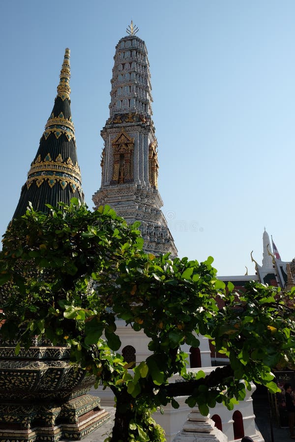 A Small Tree Grows Near the Towers of a Buddhist Temple Stock Photo ...