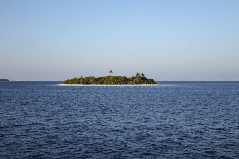 Small Tropical Island in Blue Waters of the Ocean Stock Image - Image ...