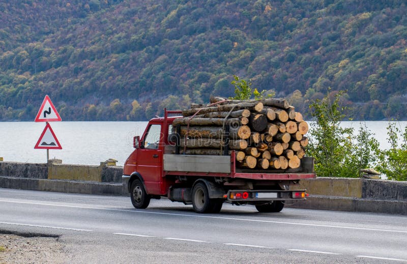 Small Truck Carrying Wood - Logs. Deforestation - Concept Stock Photo ...