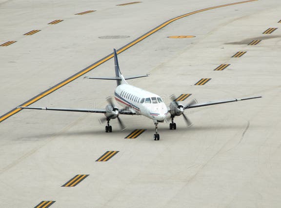 Small Turboprop Airplane on Runway Stock Image - Image of runway, inter ...