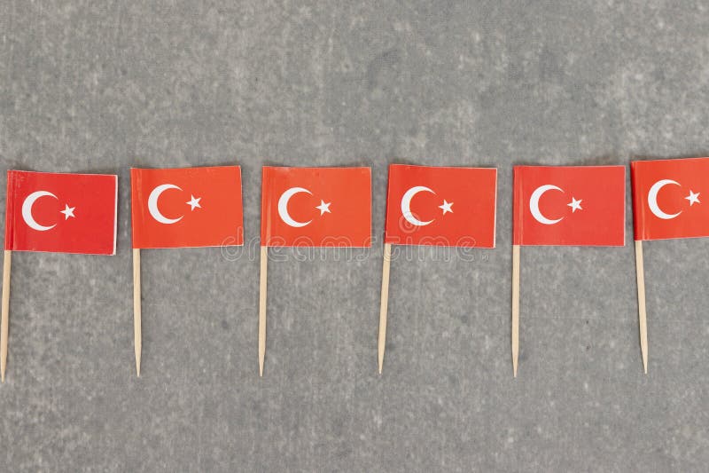 Small Turkish Flags in a Row on Grey Background Stock Photo - Image of ...