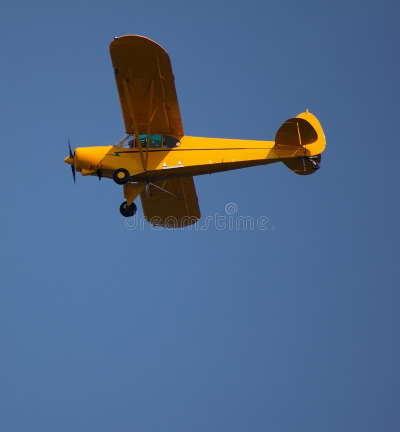 Small Two-seat Yellow Aircraft in Flight, Tourist Plane. Stock Photo ...