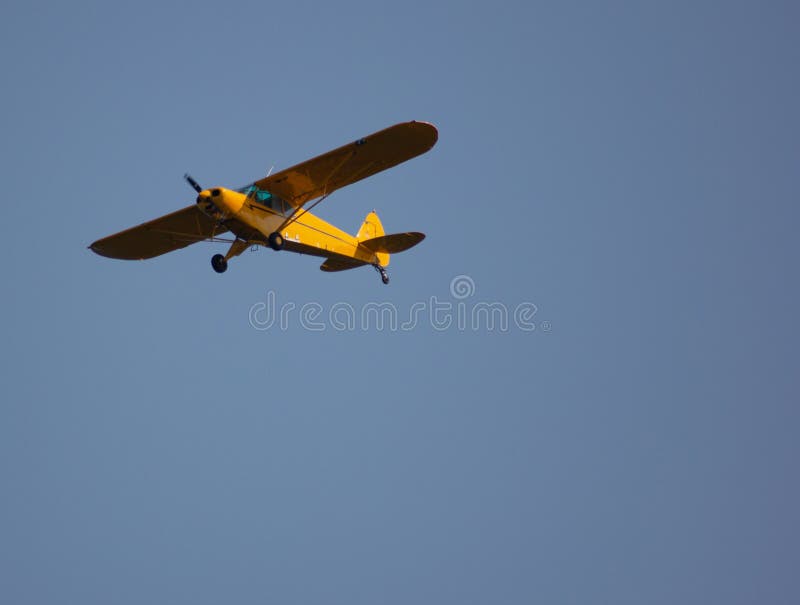 Small Two-seat Yellow Aircraft in Flight, Tourist Plane. Stock Photo ...