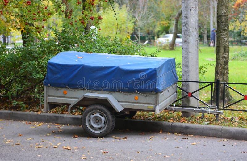 Small Two-wheeled Gray Car Trailer is Covered with a Blue Awning Stock ...