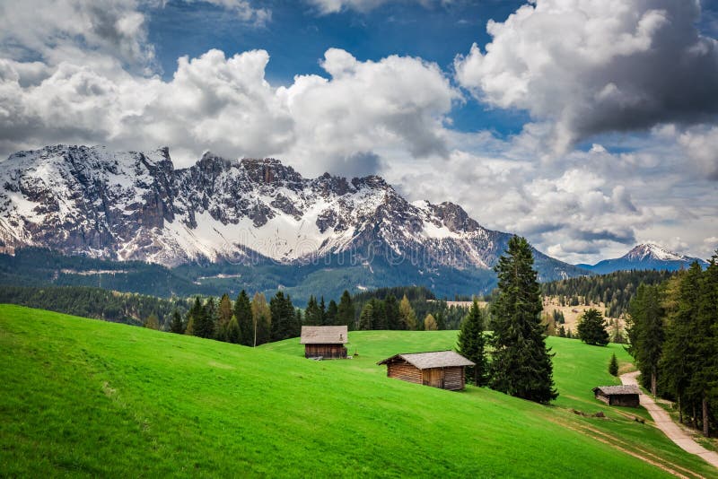 Small Valley with Cottages in Spring, Dolomites, Italy Stock Photo ...