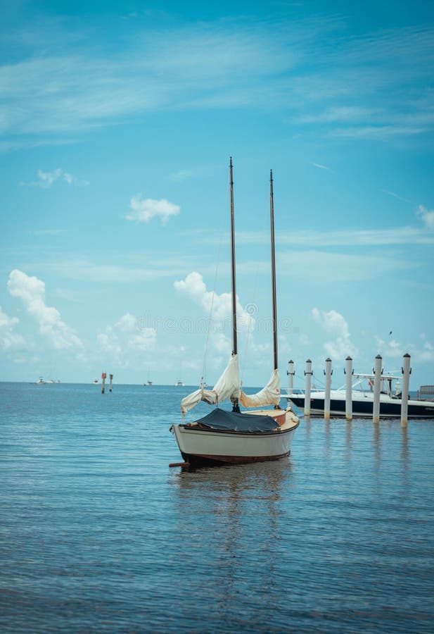 Small Vessel at Dock in Front of a Wooden Pier Stock Photo - Image of ...