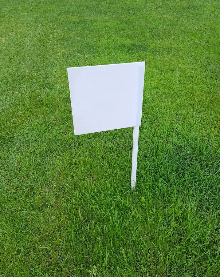 Small Warning Sign on the Background of Green Grass in the Park Stock ...