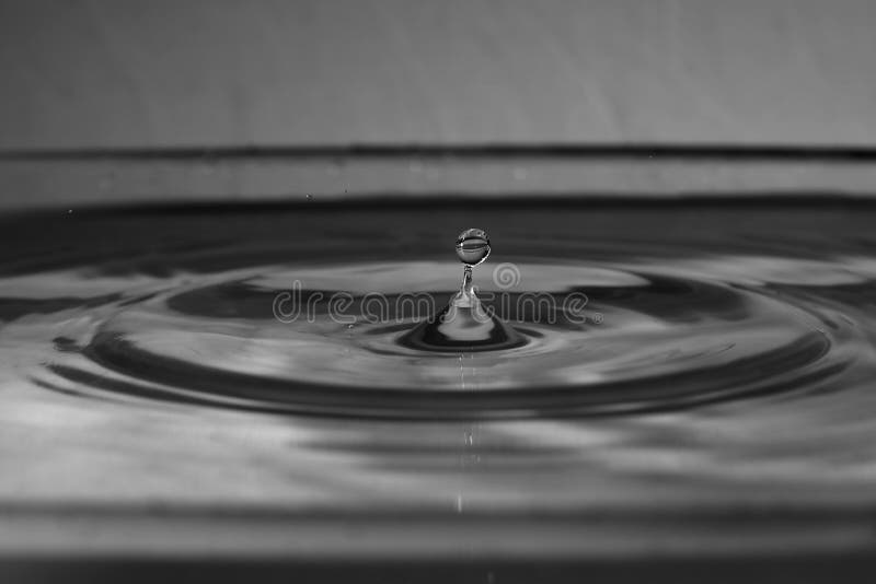 Small Water Drop Falling on the Water Surface Stock Image - Image of ...