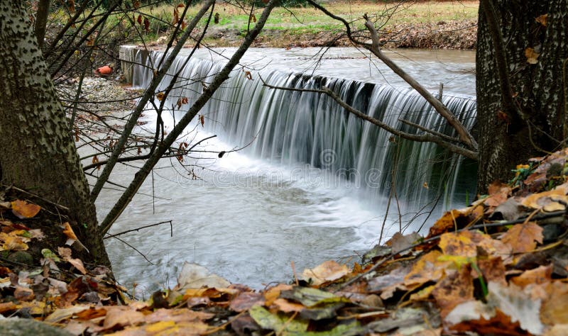 Small waterfall in autumn stock photo. Image of leaf - 47012650