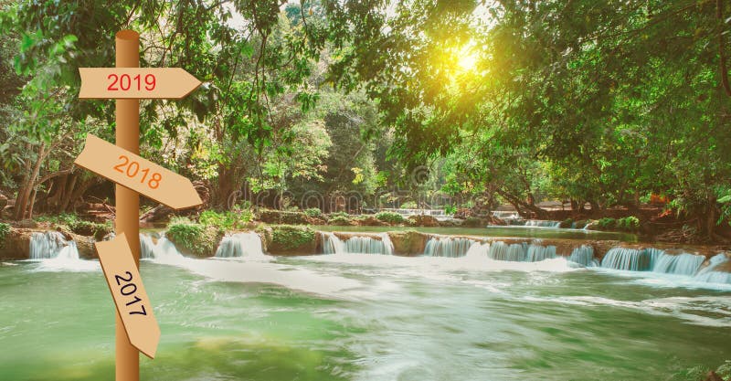Small Waterfall in Autumn Forest and Sign Pole at National Park. Stock ...