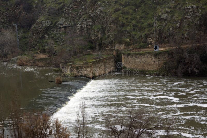 Small Waterfall Created by a Dam on a River. Natural and Man-made ...