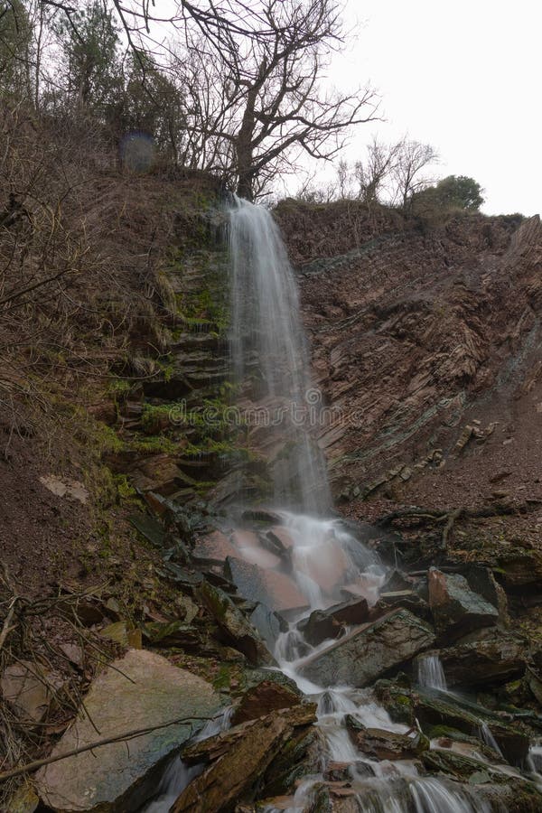 Small Waterfall Drops from a Cliff Stock Photo - Image of cascade ...