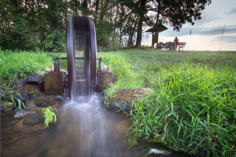 Waterfall through a Metal Structure Stock Image - Image of motion ...