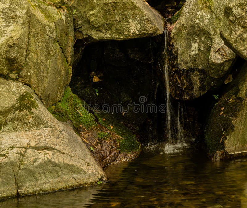 Small Waterfall Flowing Over Large Stones Stock Image - Image of ...