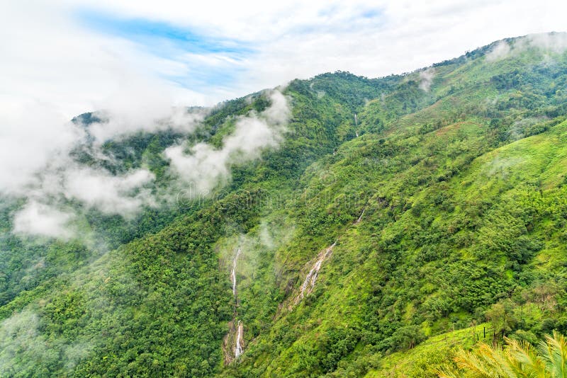 Small Waterfall on Green Mountain Ridge in Rain Forest on Cloudy Day ...