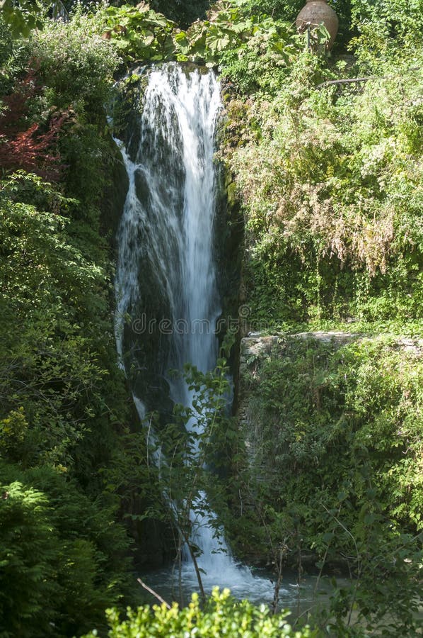 Small waterfall in park stock photo. Image of season - 145350384