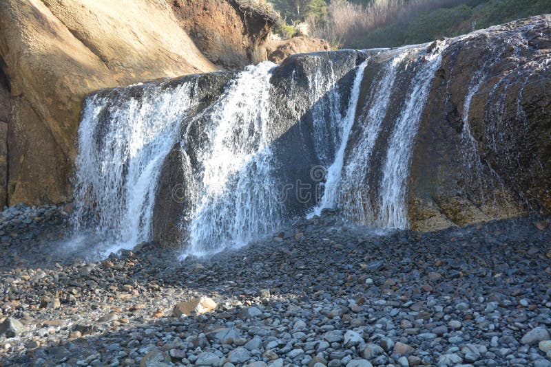 The Waterfall of Hug Point, Oregon Stock Photo - Image of shore, surf ...