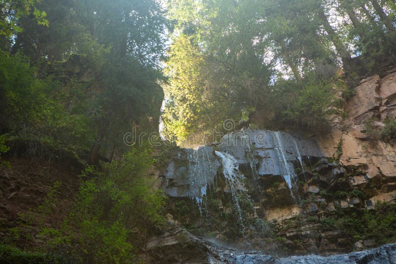 Small Waterfall on Small Mountain Stream. Water Streams with Sun Rays ...