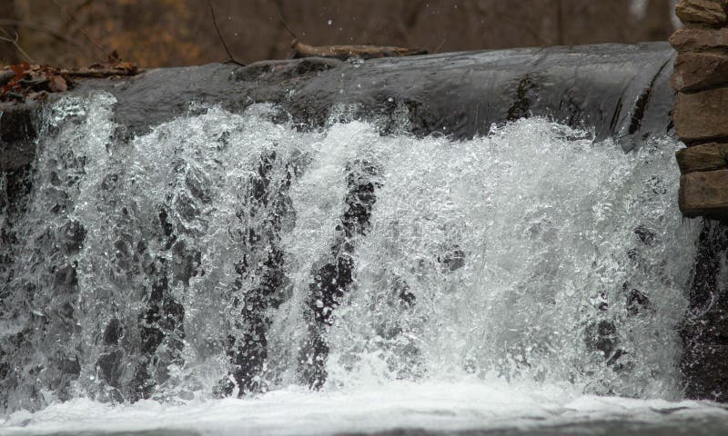Waterfall Over Rock Wall stock image. Image of wall - 207660329
