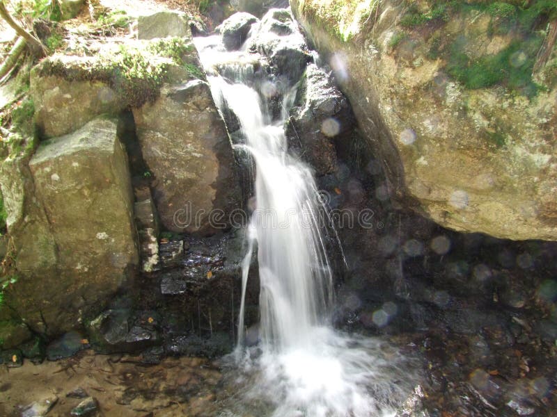 Small Waterfall Over Rocks in the Forest Stock Image - Image of stone ...