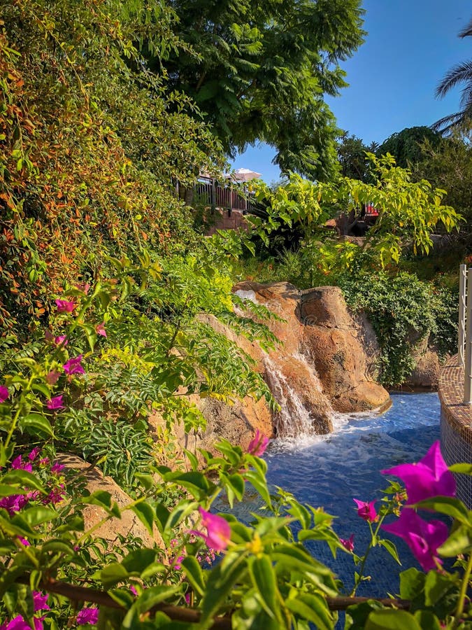 Small waterfall in a park stock image. Image of cascade - 142217481