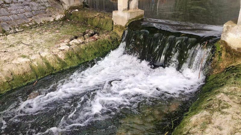 Small Waterfall on a River Dam in Public Park Stock Footage - Video of ...