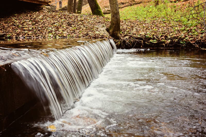 Small Waterfall River in the Forest. Spring Water Flow Stock Photo ...