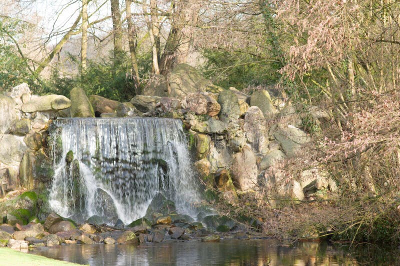 Small waterfall with rocks stock image. Image of flow - 211762593