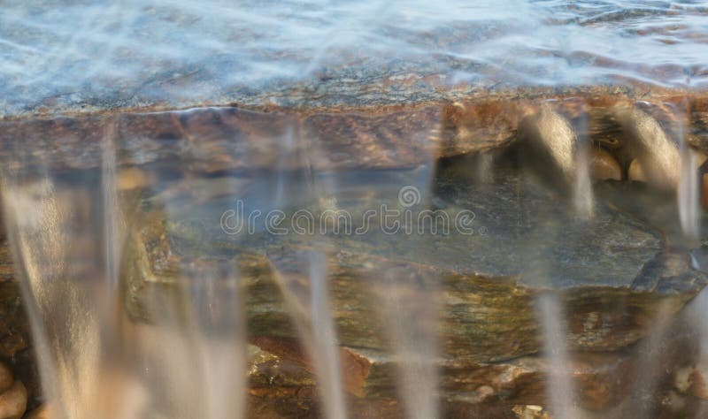 Small Waterfall Running Over Rocks Stock Photo - Image of gray, flowing ...