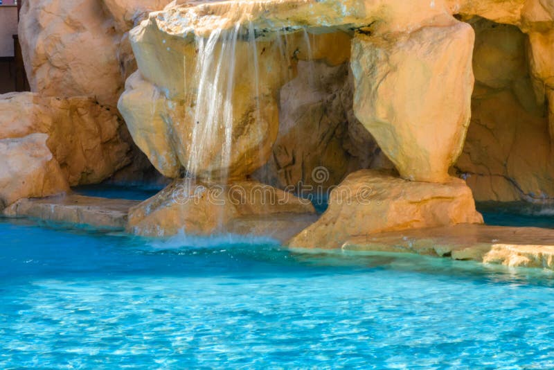 Small Waterfall with Turquoise Water in the Hotel Pool Stock Image ...