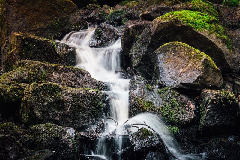 Small Waterfall with Water Running through Rocks Stock Photo - Image of ...