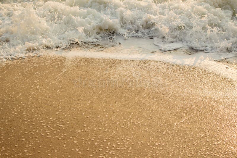 A Small Wave with Foam Rolls on the Sea Pebbles Stock Image - Image of ...