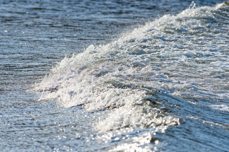 A Small Wave with Foam Rolls on the Sea Pebbles Stock Image - Image of ...