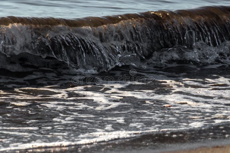 A small wave at shore stock photo. Image of surface - 120101726