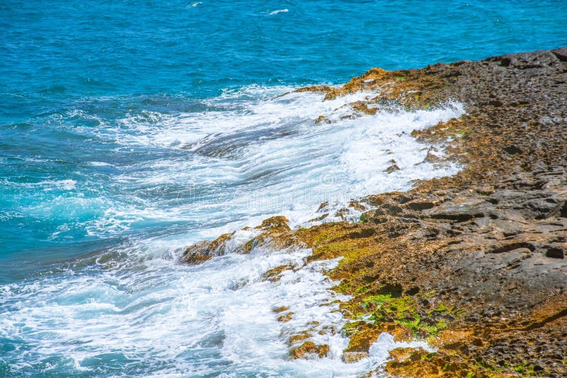 Small Waves Break on the Rocks on the Coast Stock Photo - Image of ...