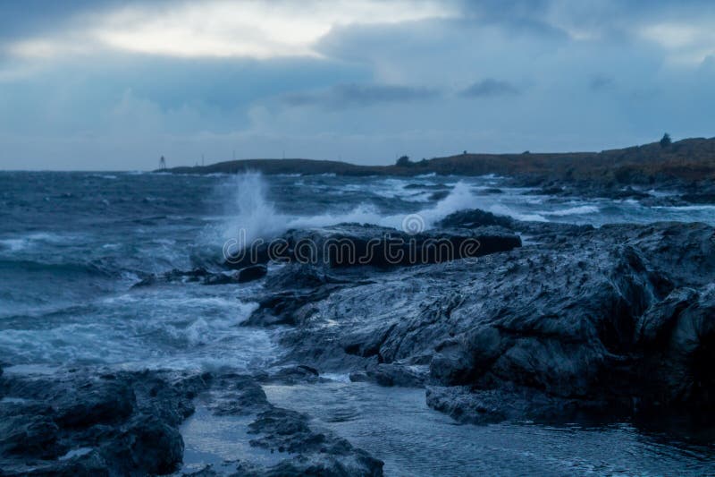 Small Waves Hitting Dark Rocks from the Ocean Stock Photo - Image of ...
