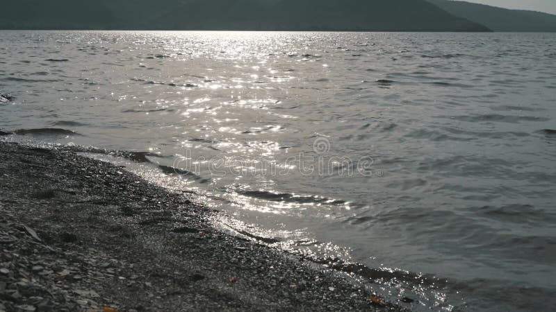 Small Waves on the Lake. View of the Hills Stock Footage - Video of ...