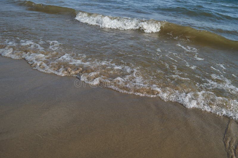 Small Waves Roll in on Sand of Riverside Beach Stock Image - Image of ...