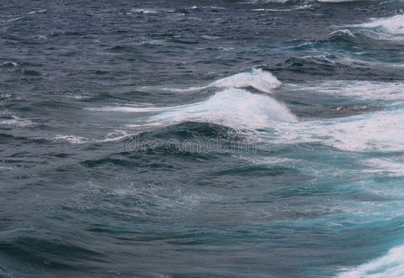 Small Waves Rolling in the Pacific Ocean in Varying Shades of Blue ...