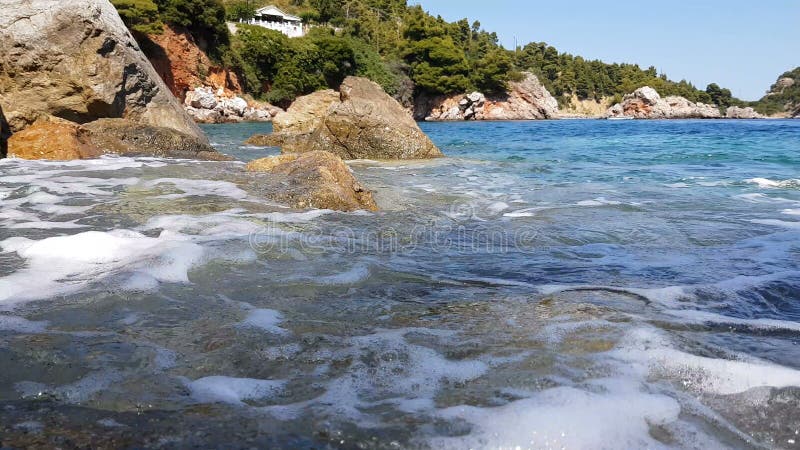 Small Waves Splashing on the Rocks at Sunset. Stock Photo - Image of ...