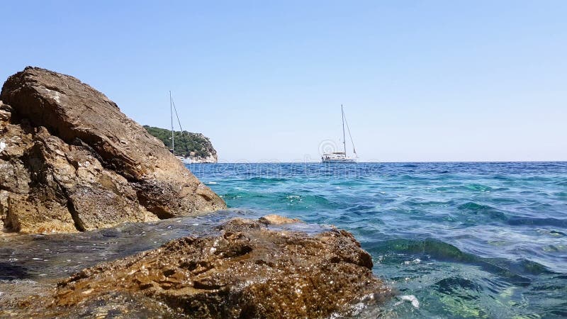 Small Waves Splashing on the Rocks at Sunset. Stock Image - Image of ...