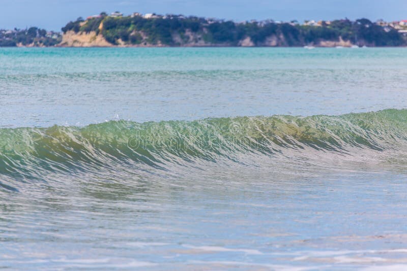 Waves roll into the beach stock photo. Image of continuously - 126918340