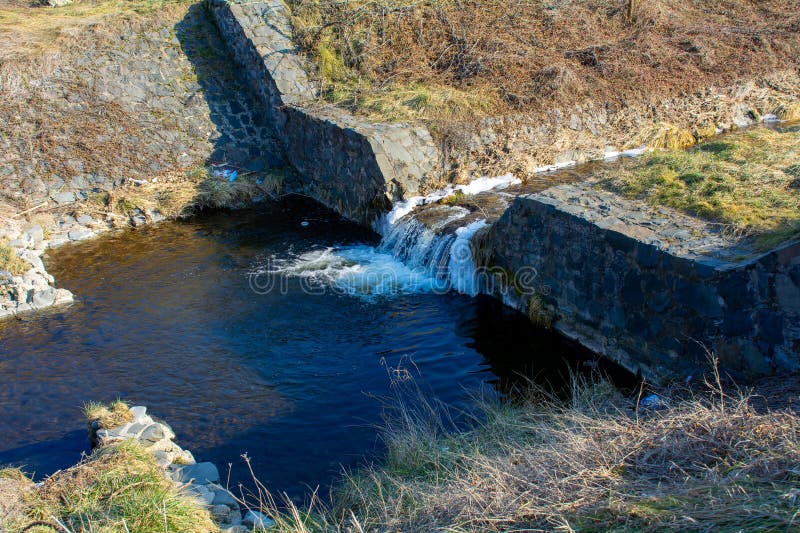 A small weir on the stream stock image. Image of geology - 376987549