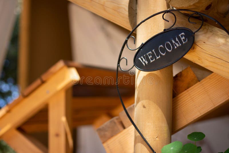 Small Welcome Sign on the Wooden Construction Stock Photo - Image of ...