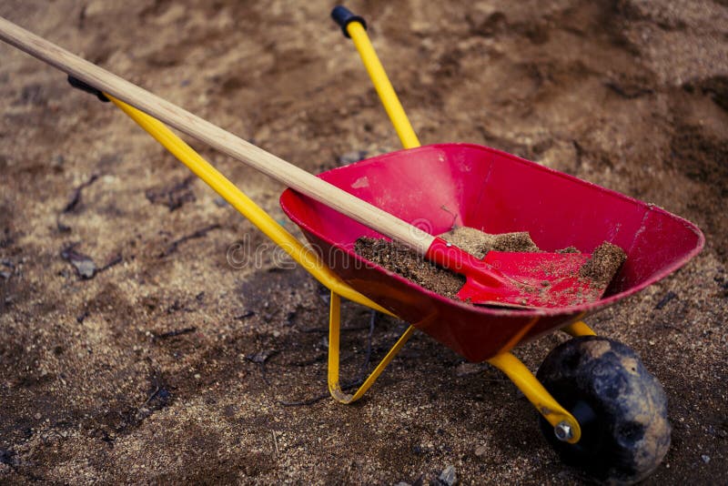 Small Wheelbarrow or Barrow with Sand - Playground Stock Photo - Image ...