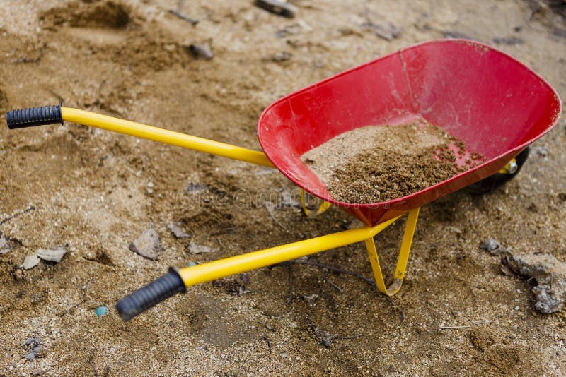 Small Wheelbarrow or Barrow with Sand - Playground Stock Photo - Image ...