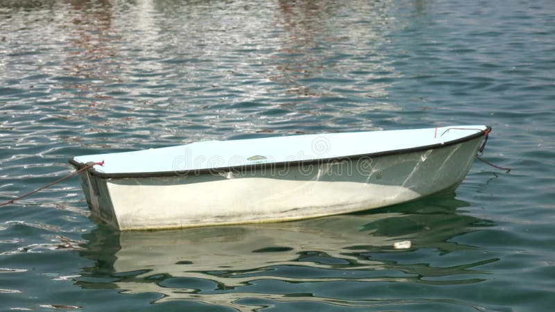 A Small Boat on the River with a Bridge in the Background. Stock Video ...