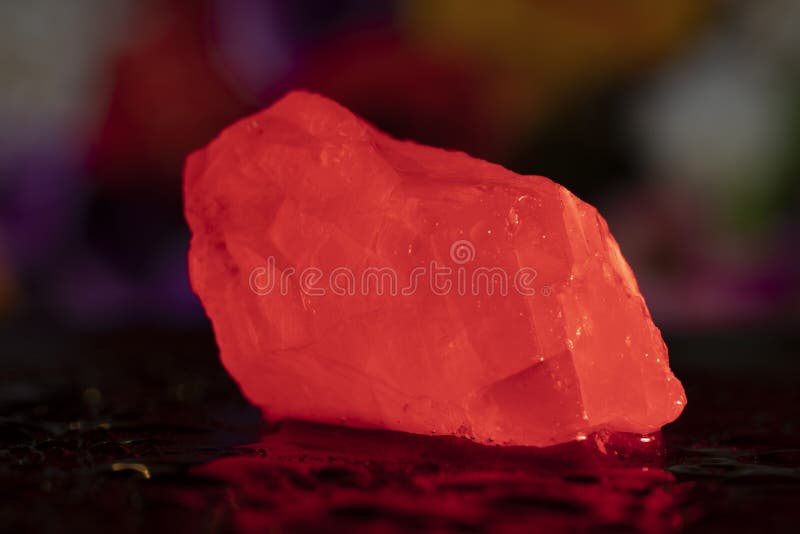 Small White Calcite Stone on the Wet Surface in the Red Light Stock ...