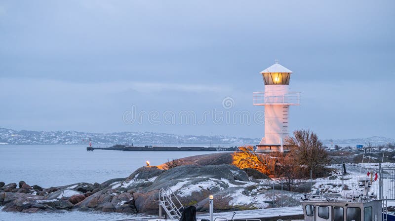 Small White Lighthouse by the Harbour.. Stock Photo - Image of ...