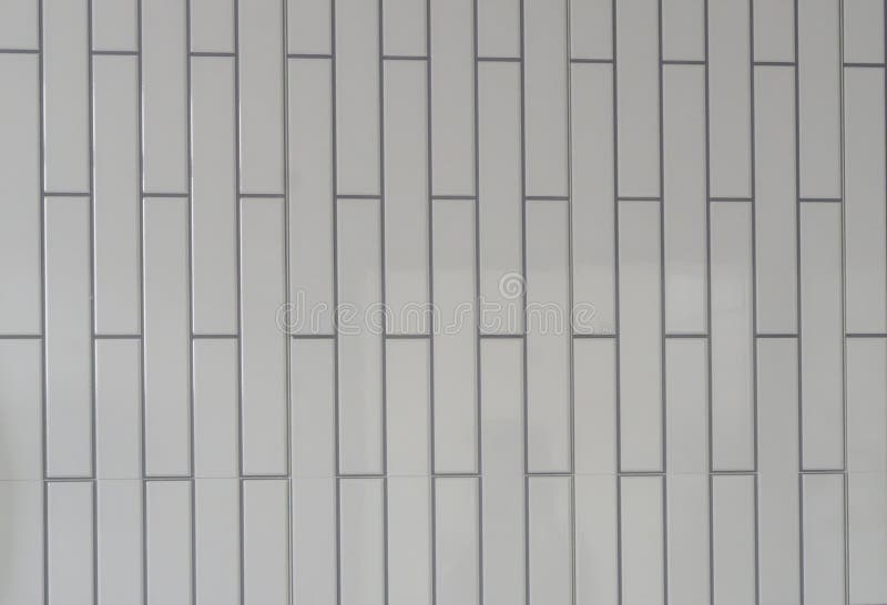 Small White Tiled Wall with Vertical Pattern Used for Background or ...